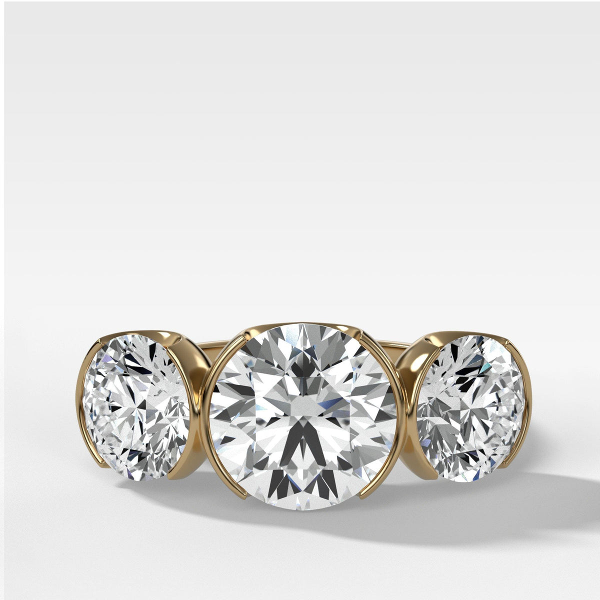 Half Bezel Triad Engagement Ring With Round Cut Diamonds