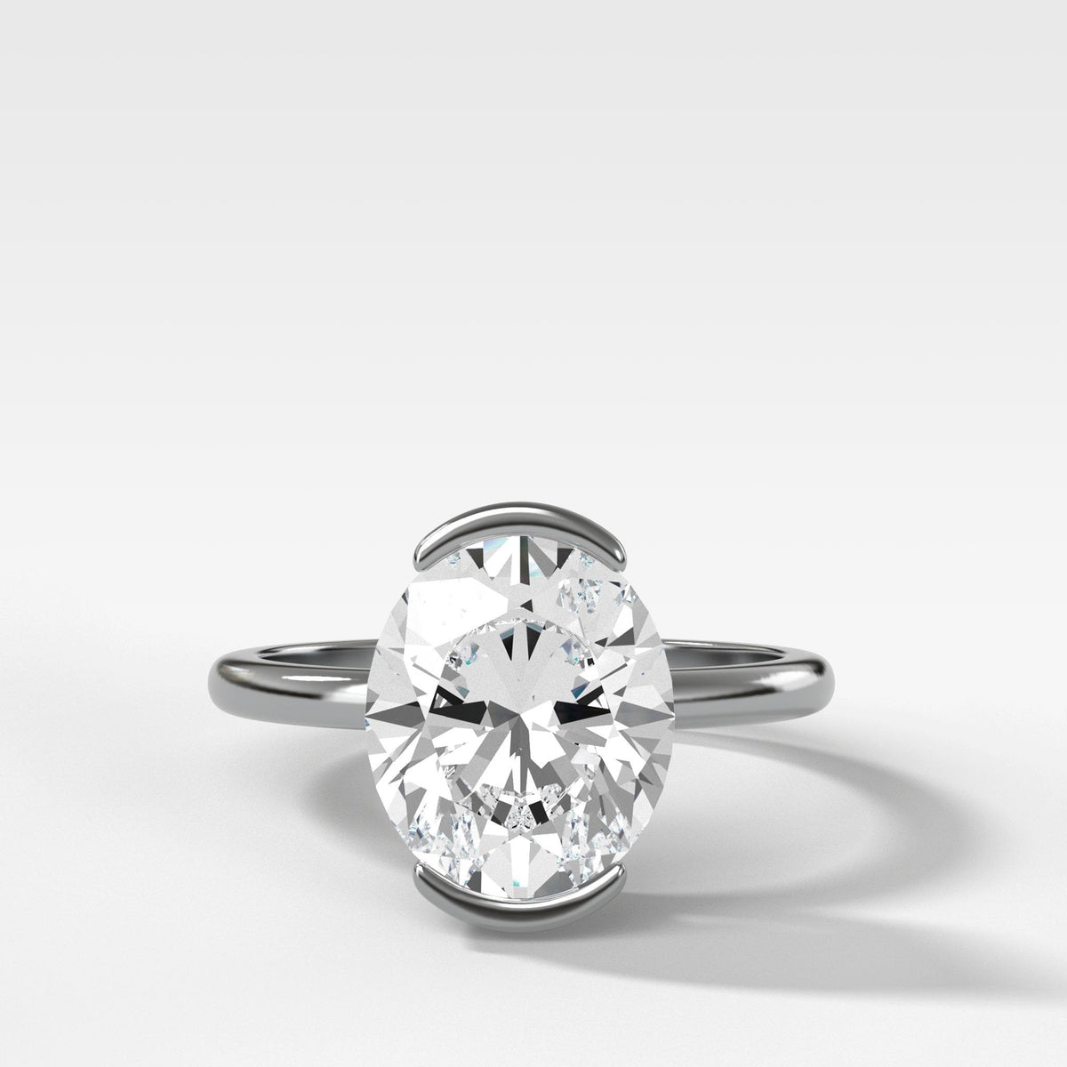 North South Half Bezel Solitaire Engagement Ring With Oval Cut Diamond