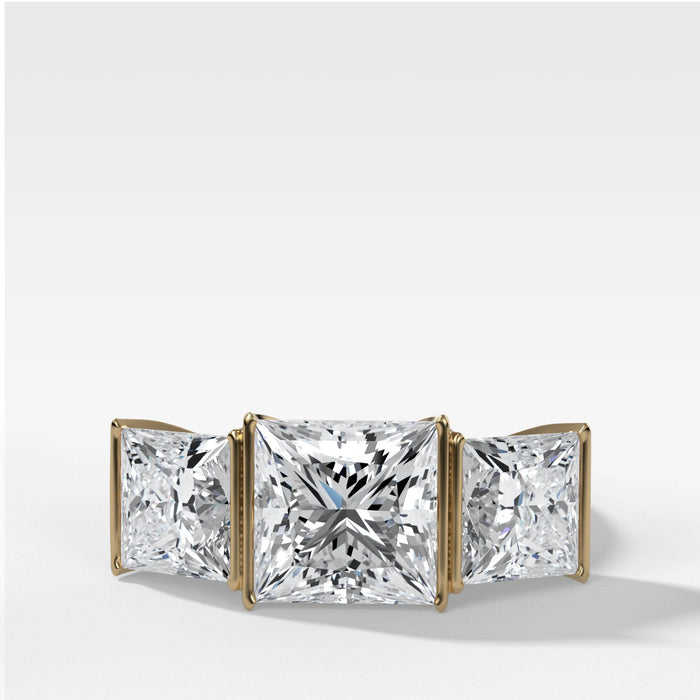 Half Bezel Triad Engagement Ring With Princess Cut Diamonds